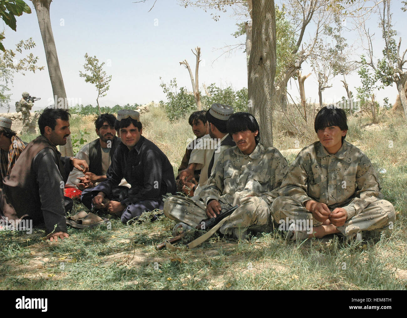 Afghan Border Police members participate in a village shura near the ...