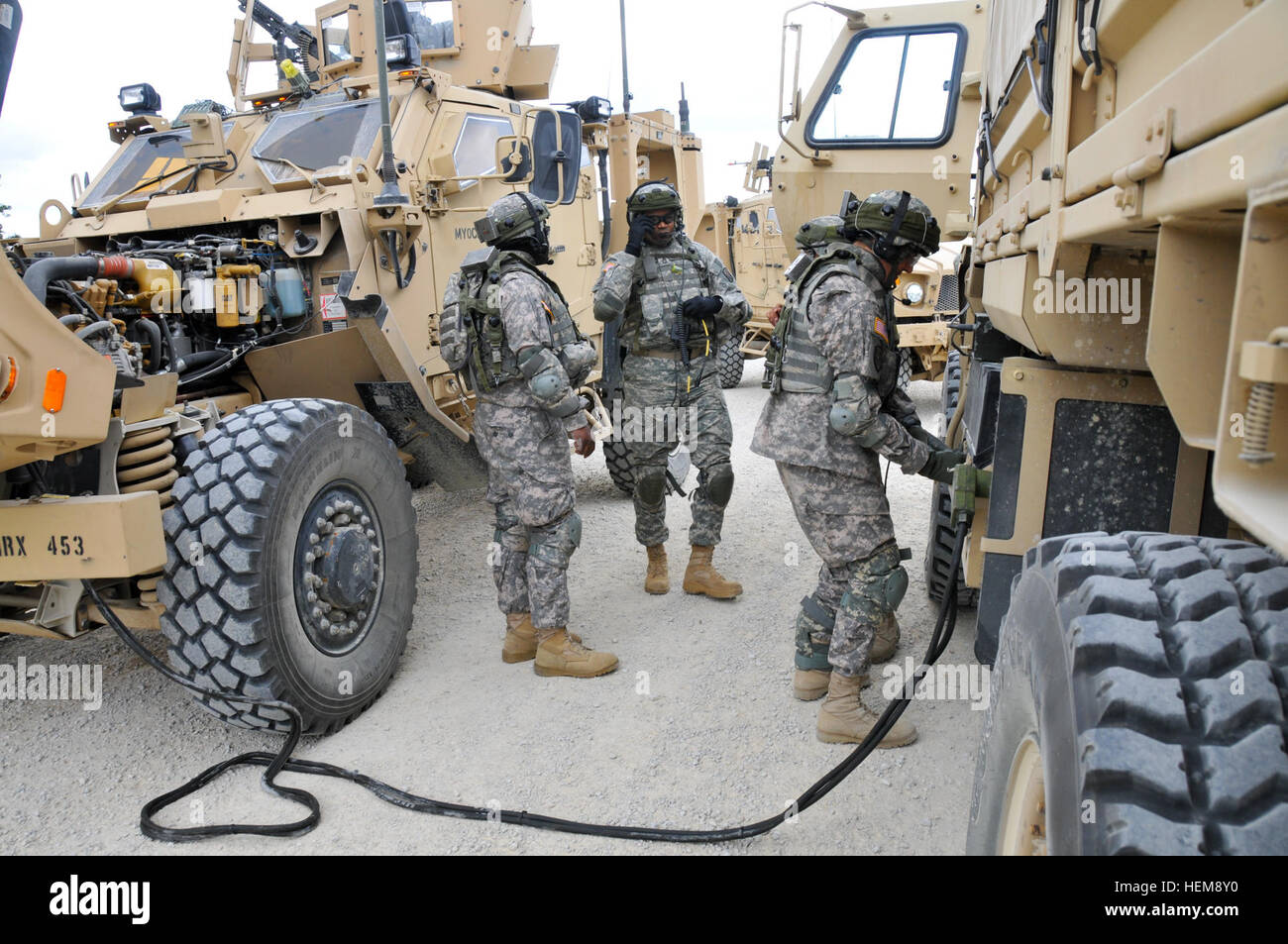U.S. Army Soldiers of the 66th Transportation Company jump start a ...