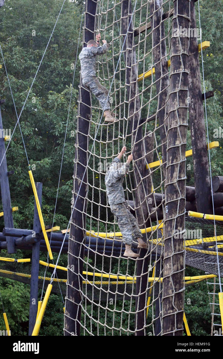 Soldiers of the 101st Airborne Division climb down a cargo net on one ...