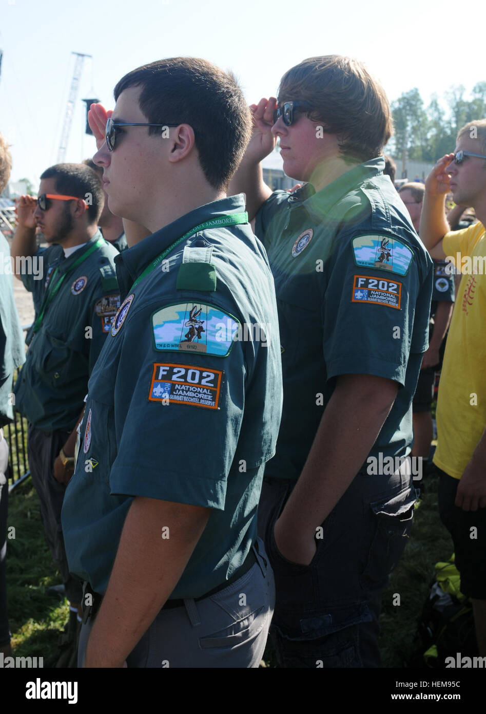 Scouts salute during the presentation of colors at the opening ceremony ...