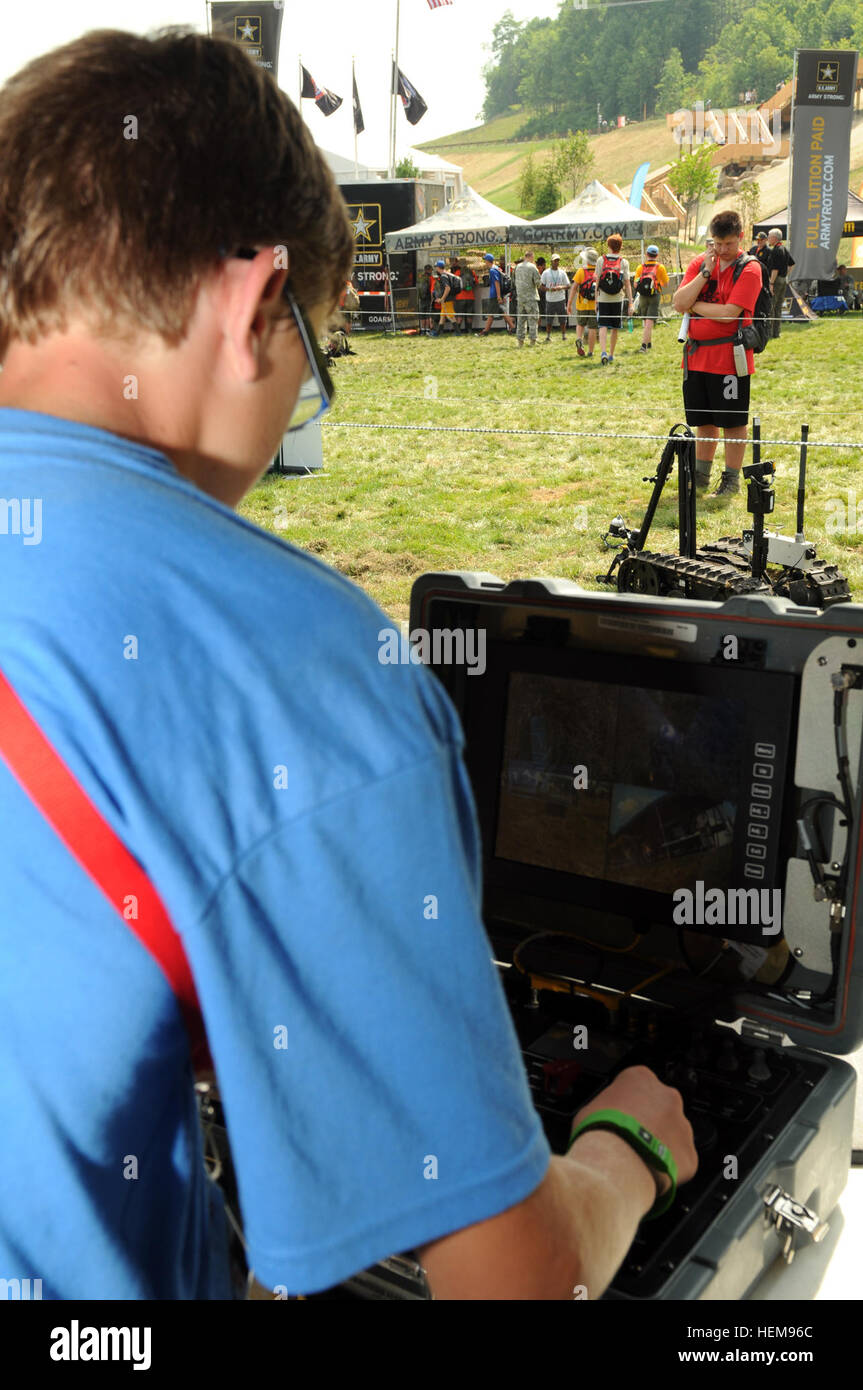 A Boy Scout operates the TALON robot during a training exercise at the ...