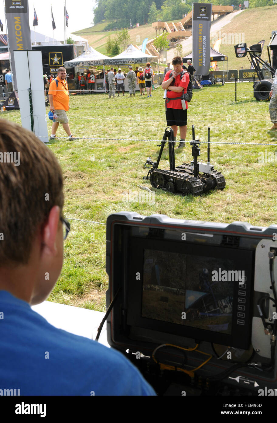 A boy scout operates machinery to complete a TALON training exercise at ...
