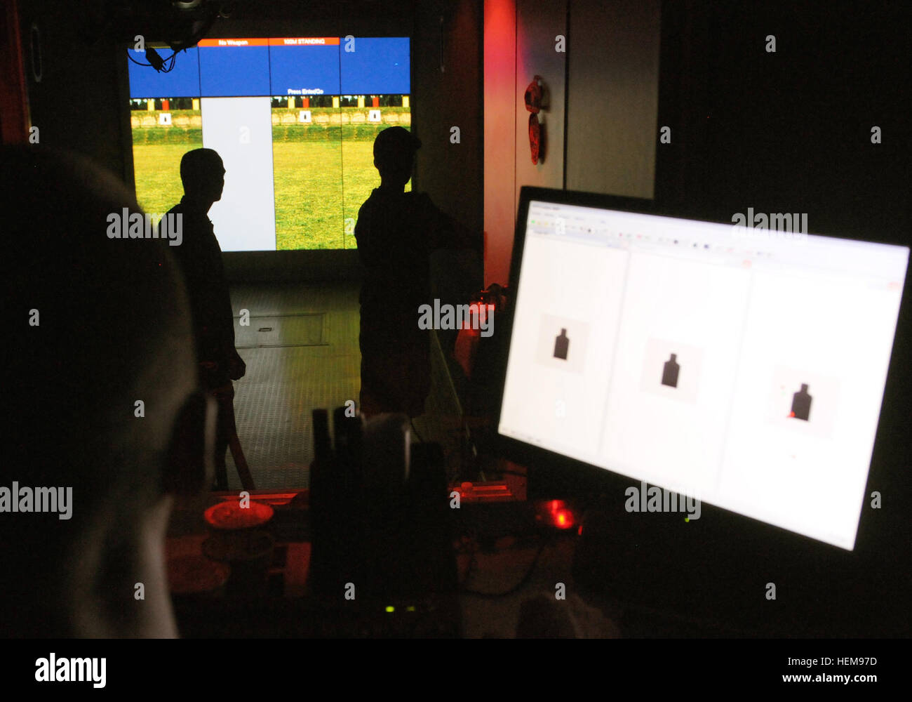 As Petty Officer 3rd Class Cameron T. Hutchens operates the equipment ...