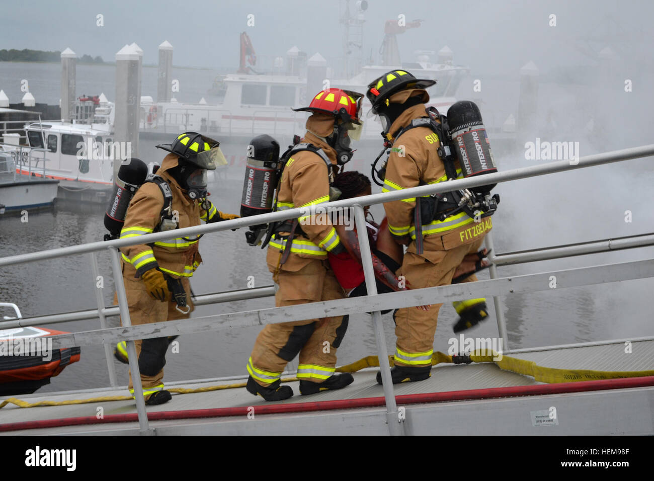 Firefighters assigned to the 596th Transportation Brigade, Military ...
