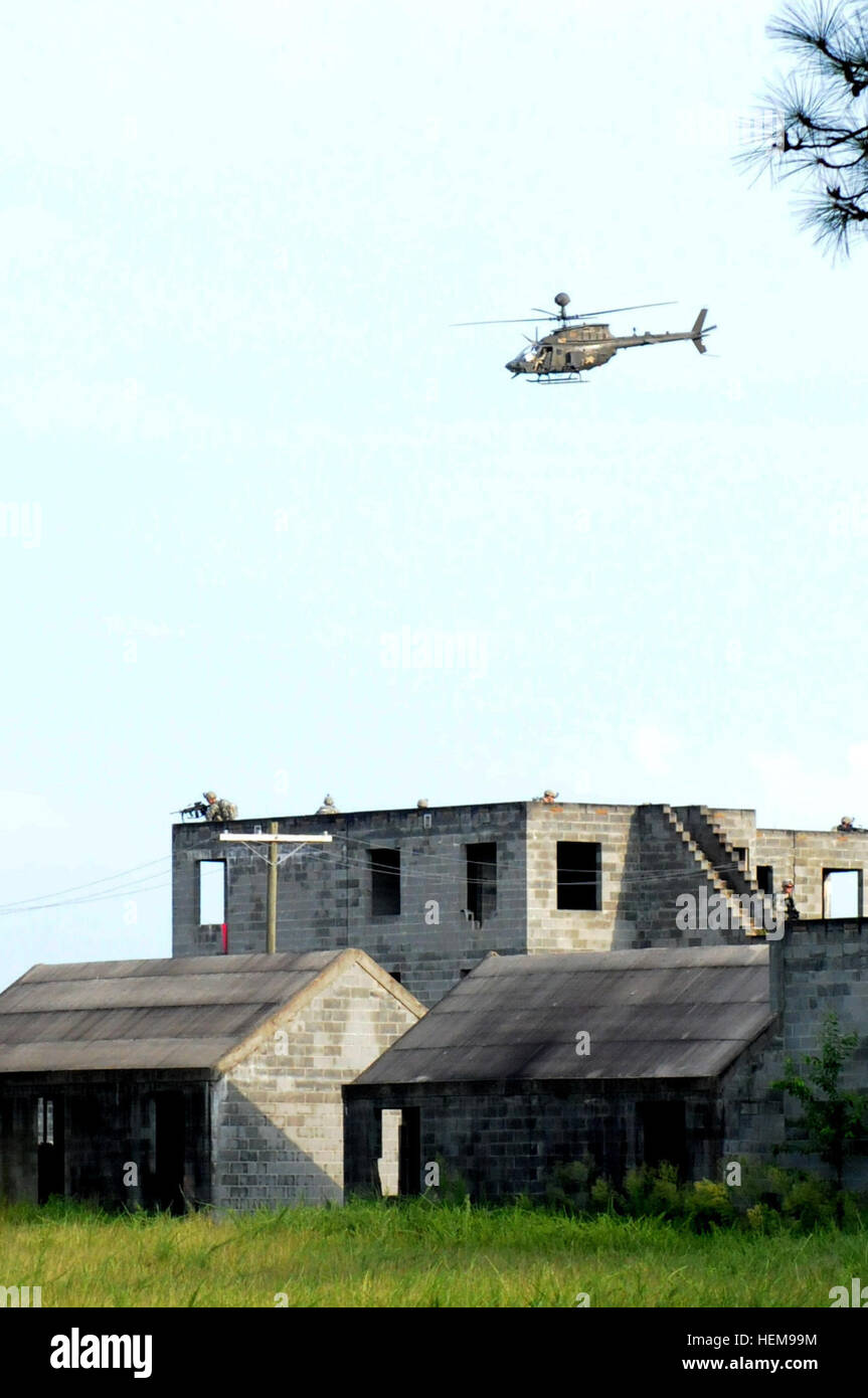 Paratroopers clear a building from floor level to rooftop, while a ...