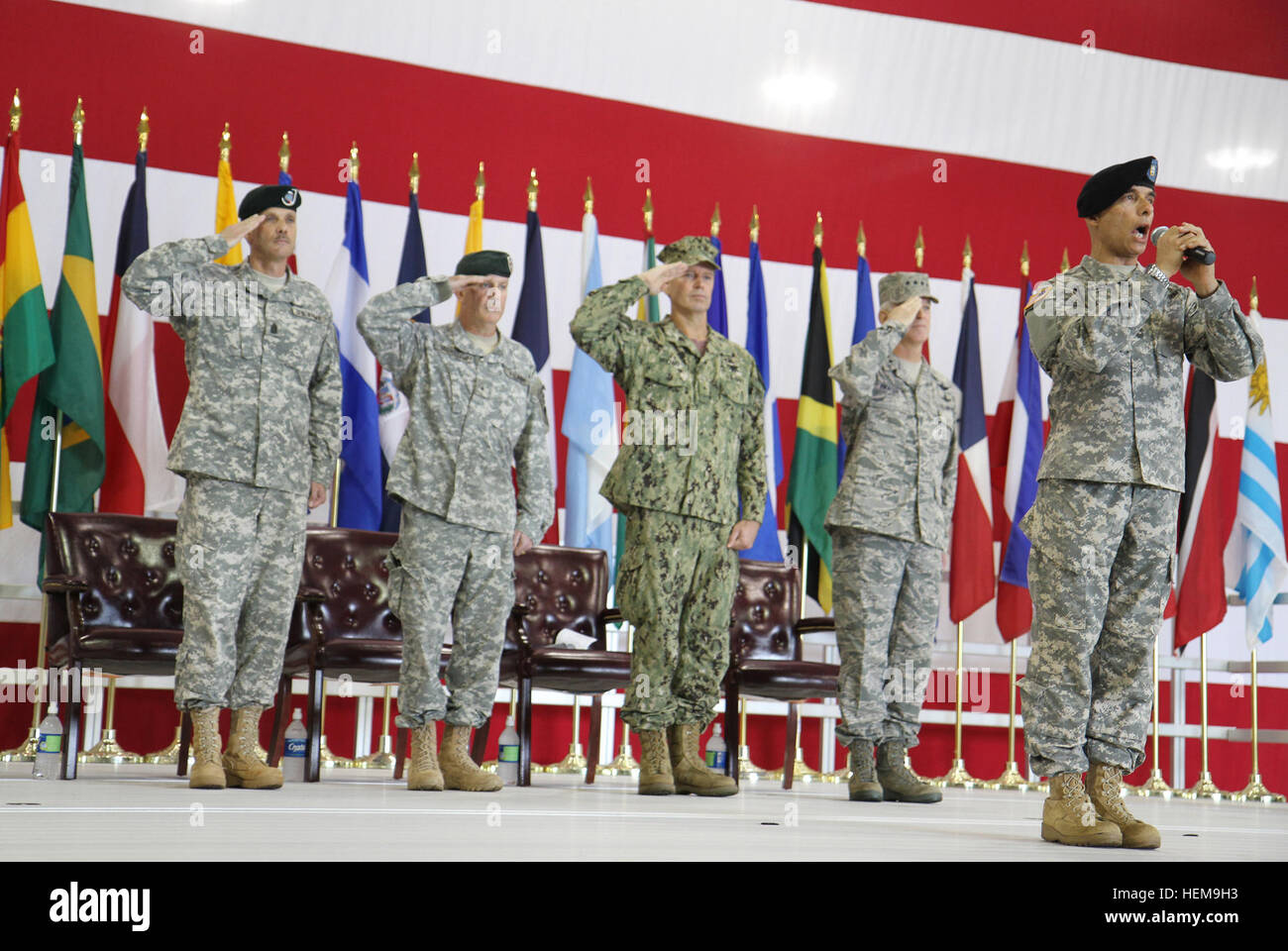 Members of the official party salute as U.S. Army Master Sgt. Antonio ...