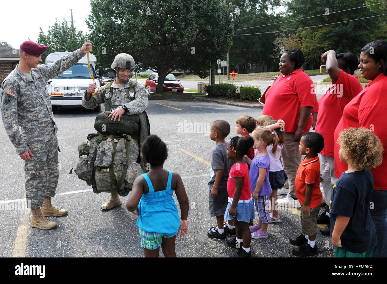 Sgt. Renald Thompson holds the static line for Spc. Adam Hesley, who is ...