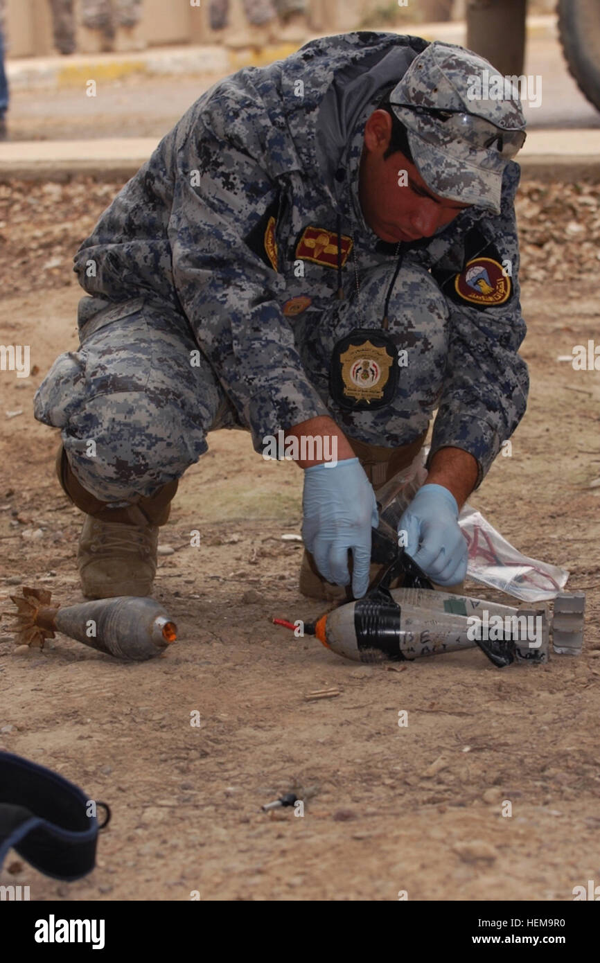 A policeman with the Iraqi Federal Police Explosive Ordnance Disposal ...