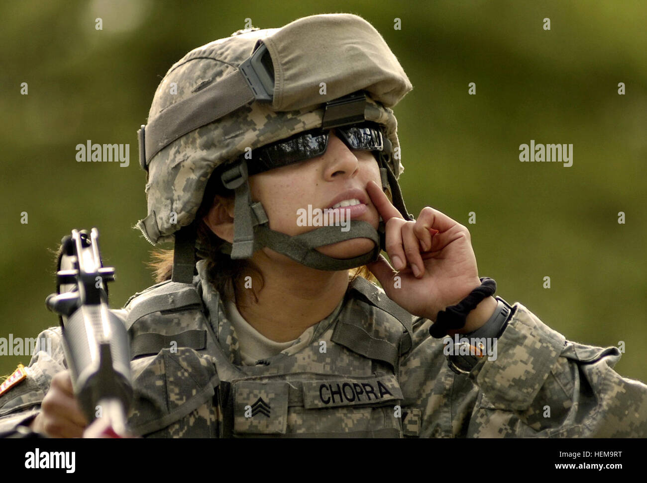 070426-A-0559K-449 U.S. Army Sgt. Jasmine Chopra listens to a brief ...