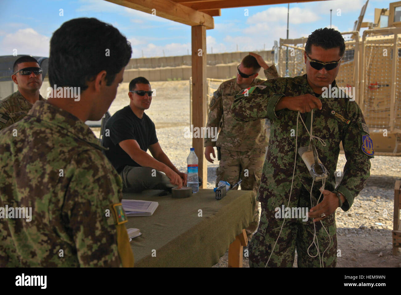 Afghan National Army (ANA) Sgt. 1st Class Mohammad Nazif, right ...