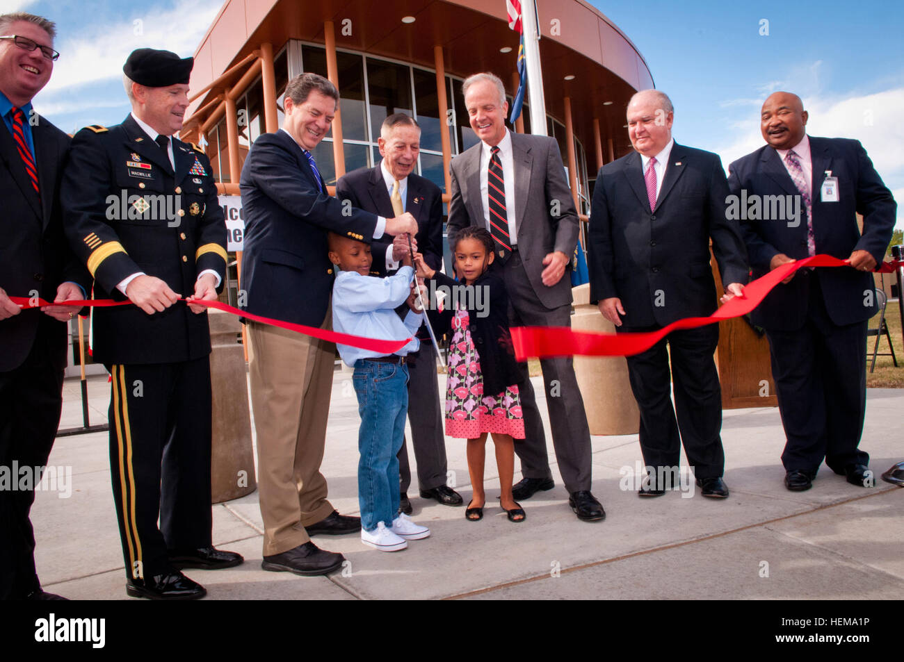 Senior military and civilian leaders gather to cut the ribbon at the ...