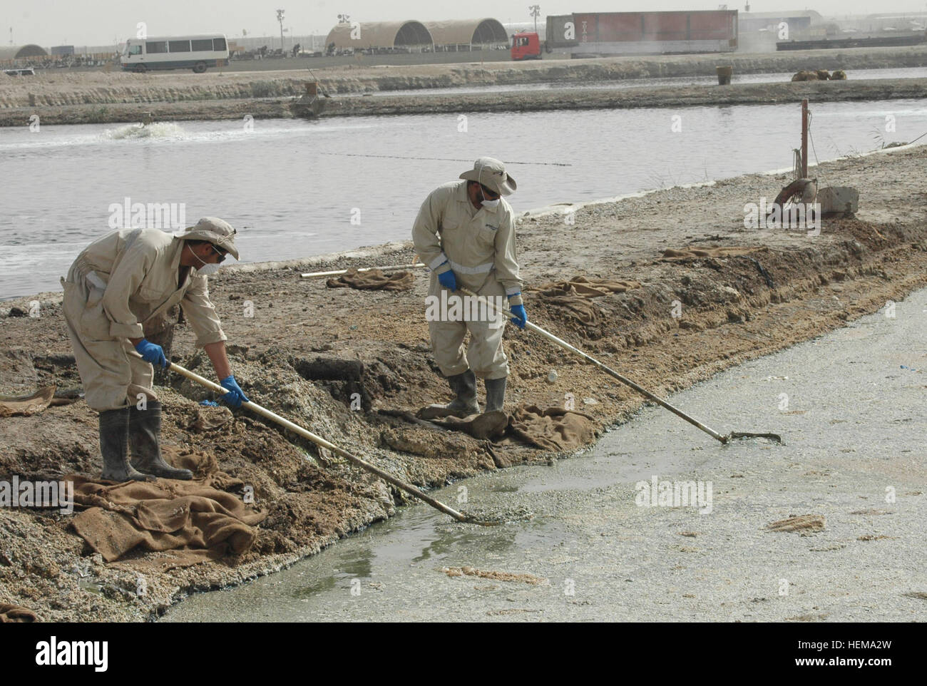 Employees of ATCO Frontec Europe skim Kandahar Airfield's Poo Pond on ...