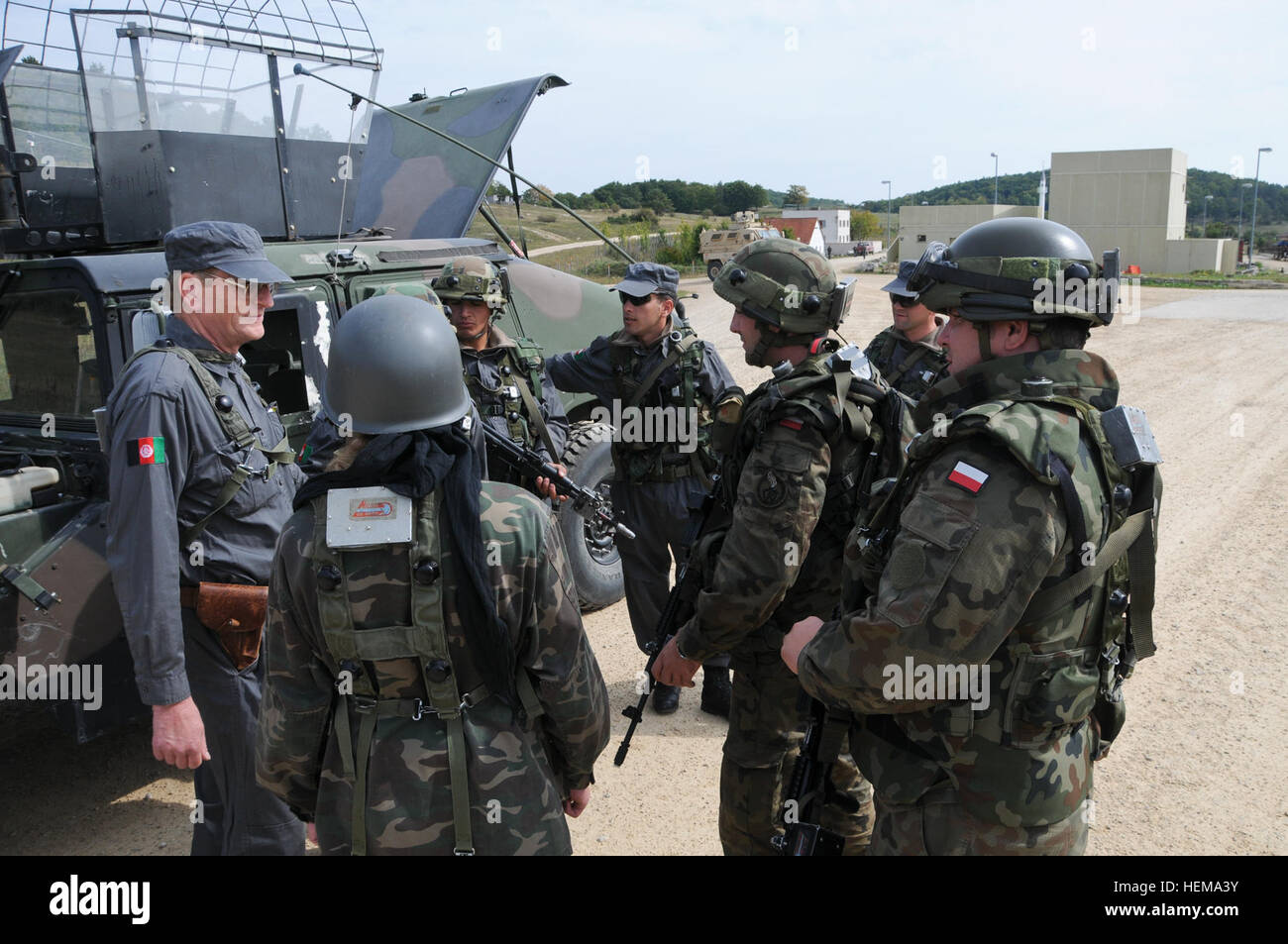 Polish army soldiers (right) speak with Azerbaijan Armed Forces ...