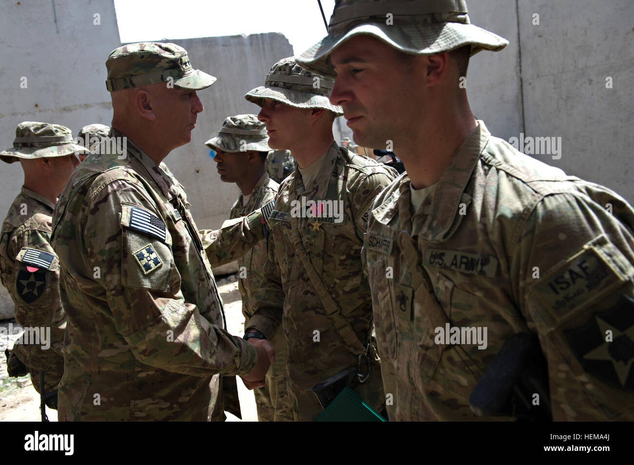 U.S. Army Chief of Staff Gen. Raymond T. Odierno shakes the hand of a ...