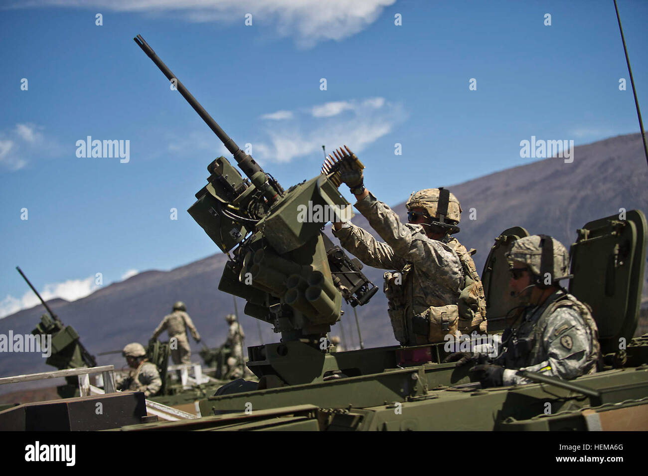 U.S. Army Spc. Warren Feeley (center right), Alpha Company, 1st ...
