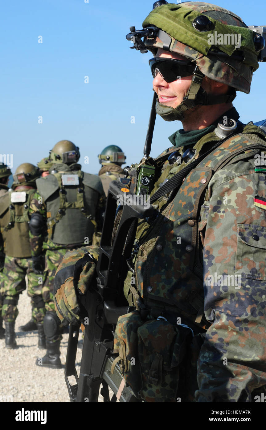 A German soldier of the 313th Parachute Battalion receives instructions ...