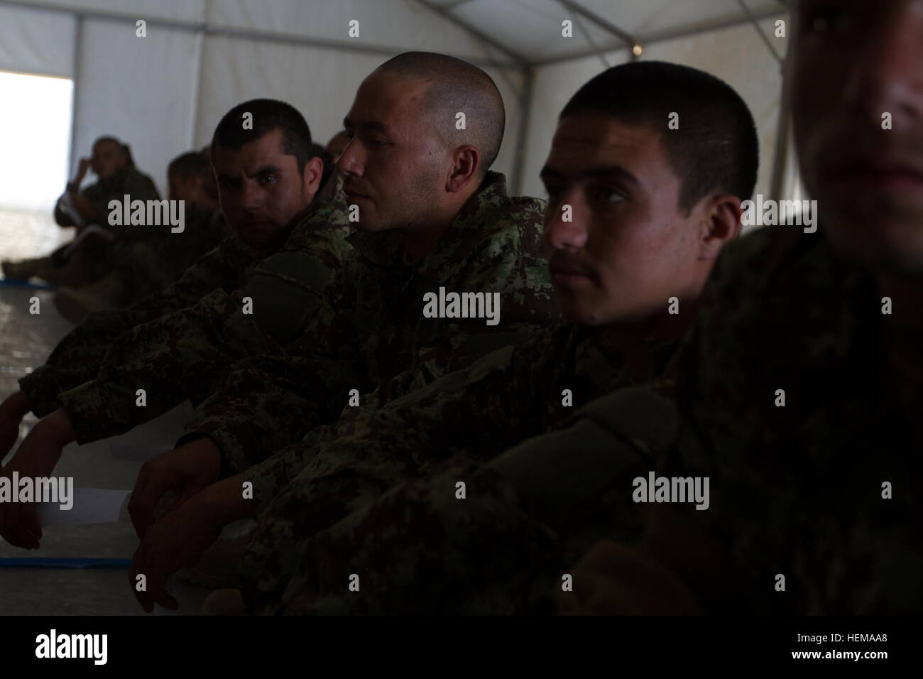 Afghan National Army recruits wait to be screened during the biometrics ...