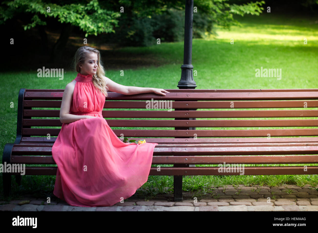 girl sits on park bench Stock Photo - Alamy