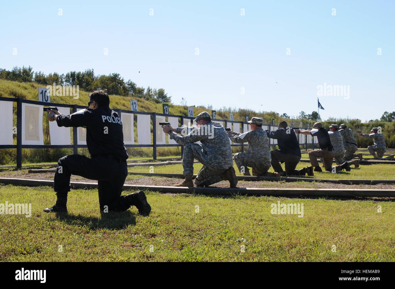 Special agents and law enforcement personnel qualify on weapons during ...