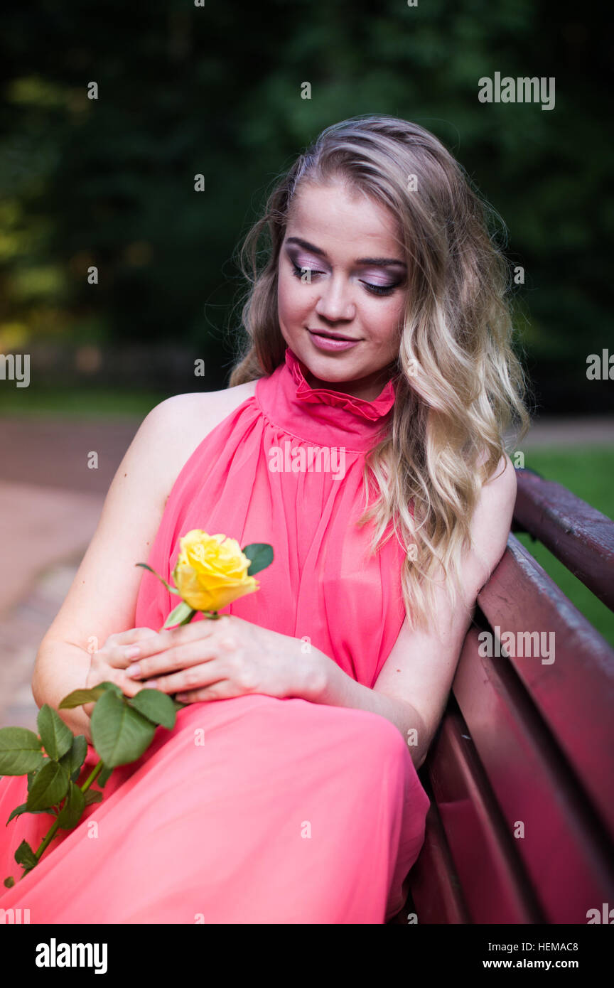 girl sits on park bench Stock Photo - Alamy