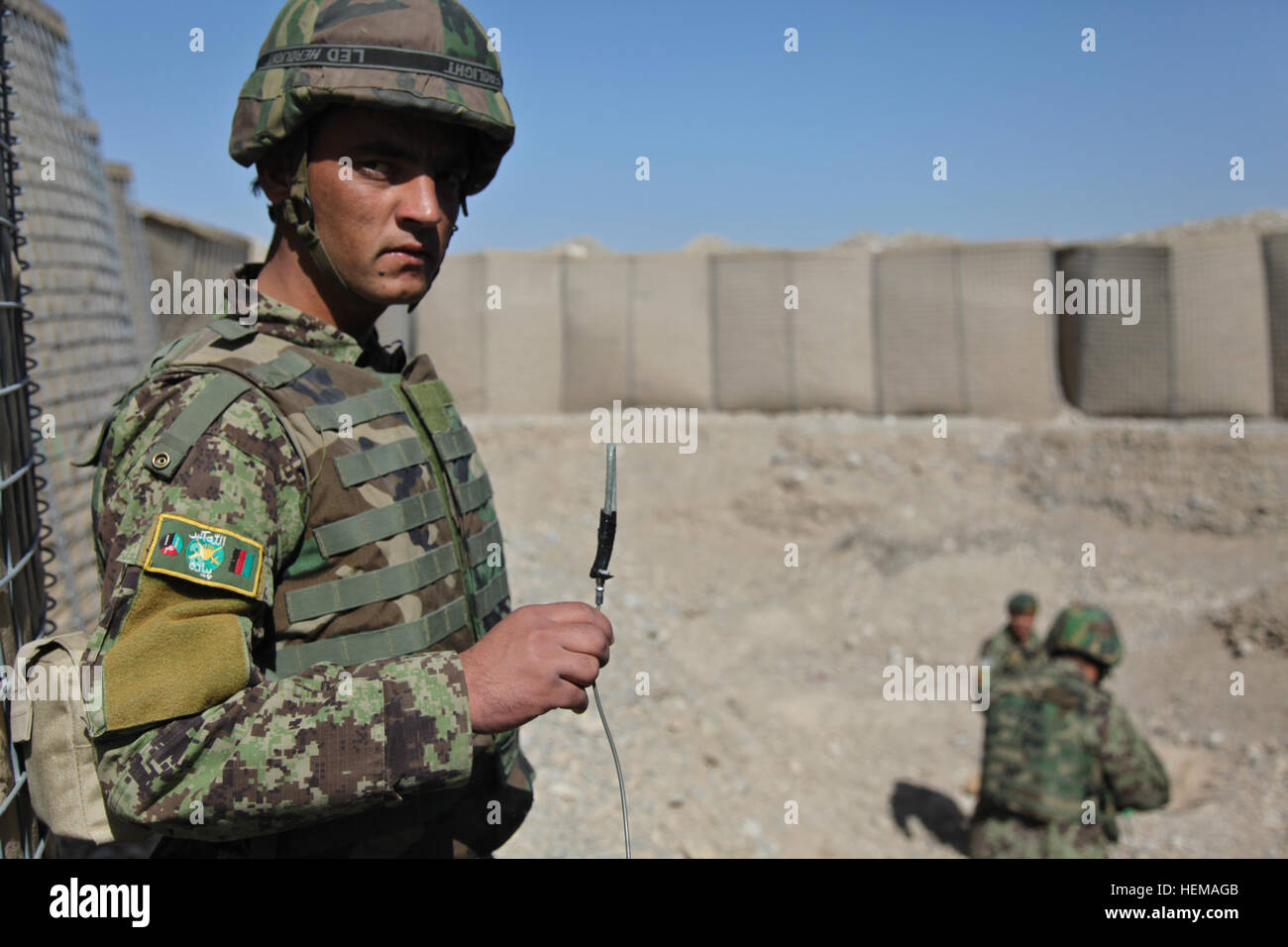 An Afghan National Army (ANA) soldier prepares a controlled detonation ...