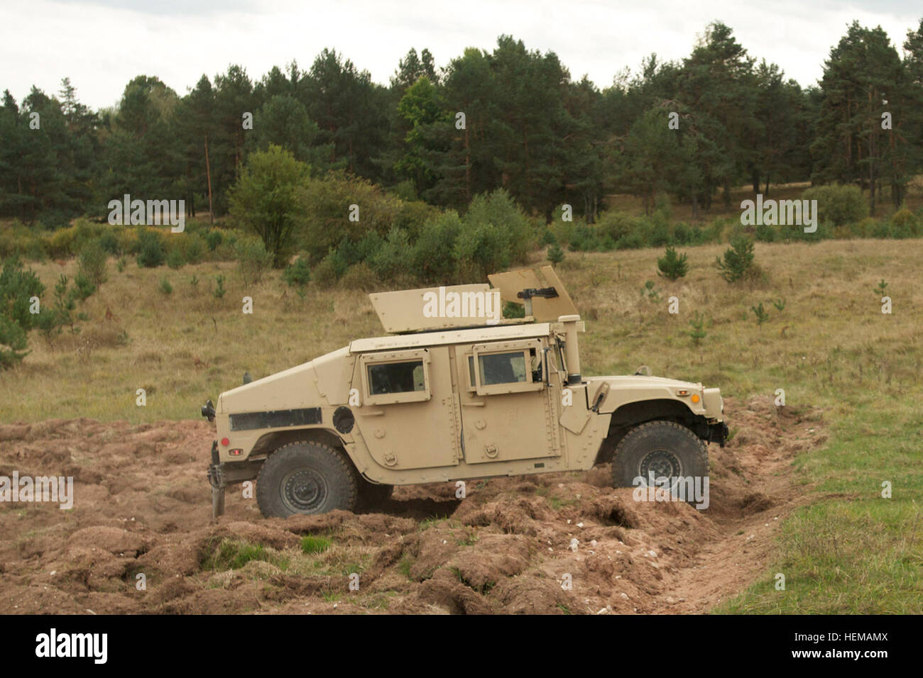 Soldiers of the 615th MP Company enter an obstacle path driving a on ...