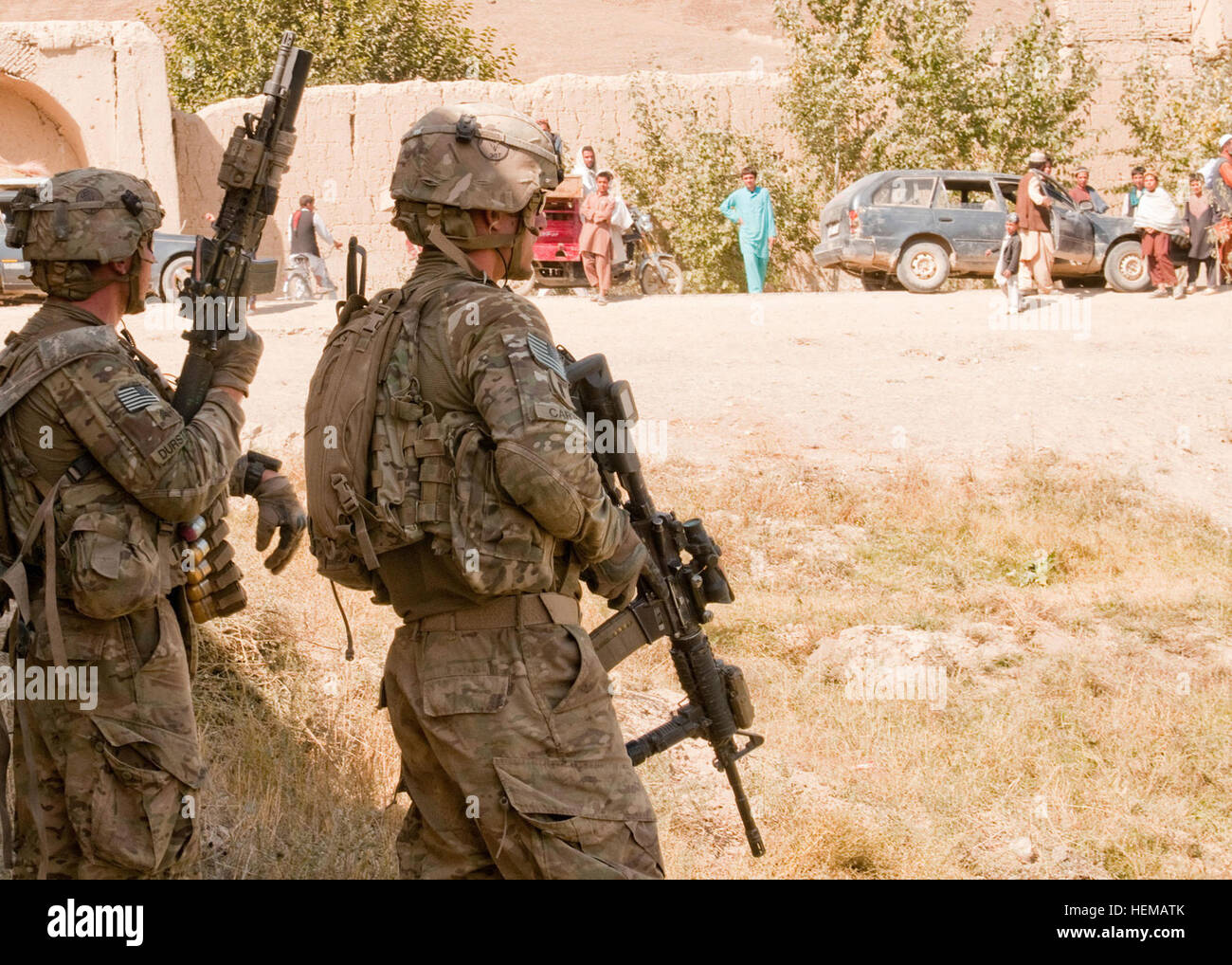 U.S. Army Sgt. Jeremiah Durstine, a team leader (left), and U.S. Army ...