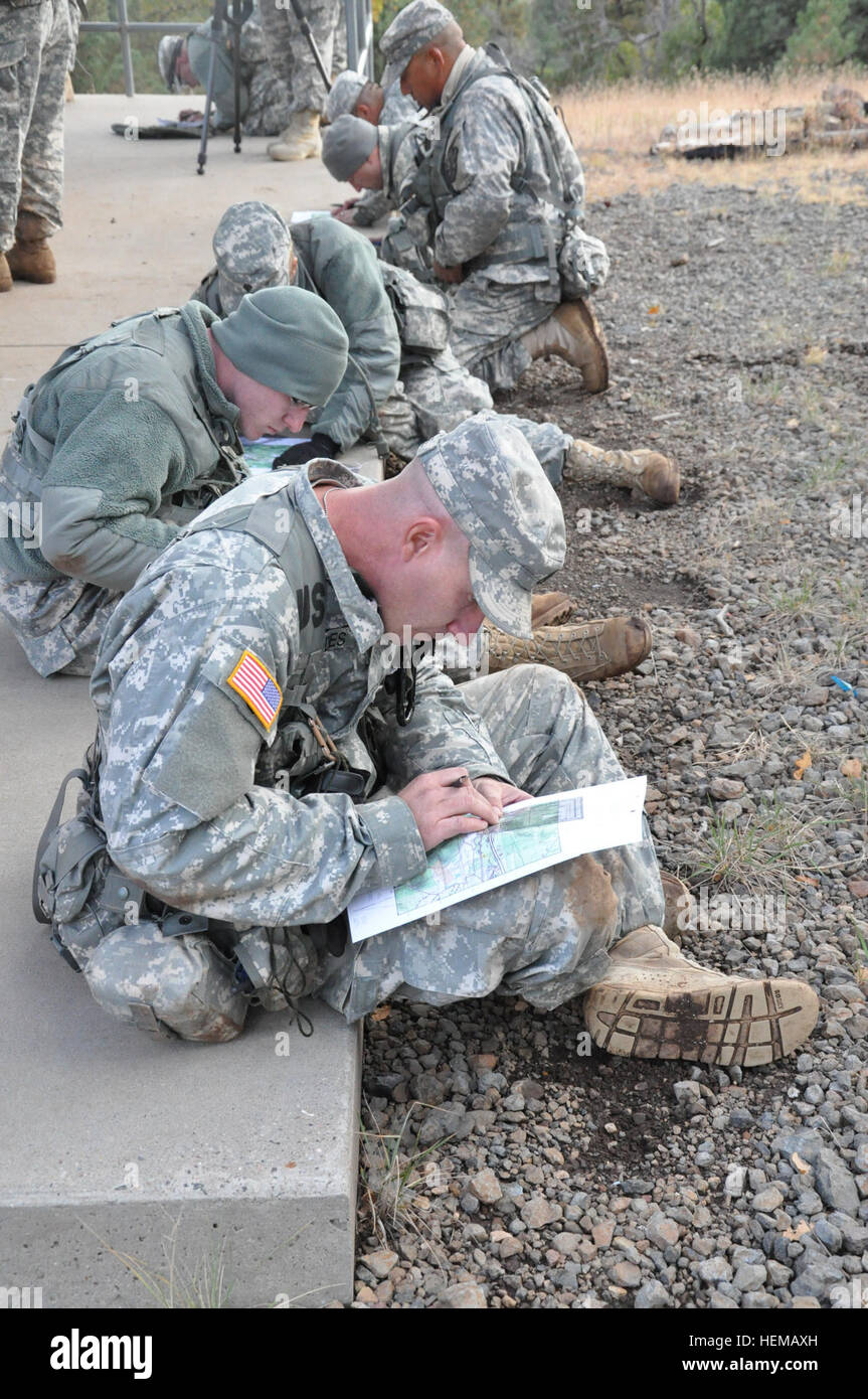 Guard members prepare their maps during the land navigation evaluation ...