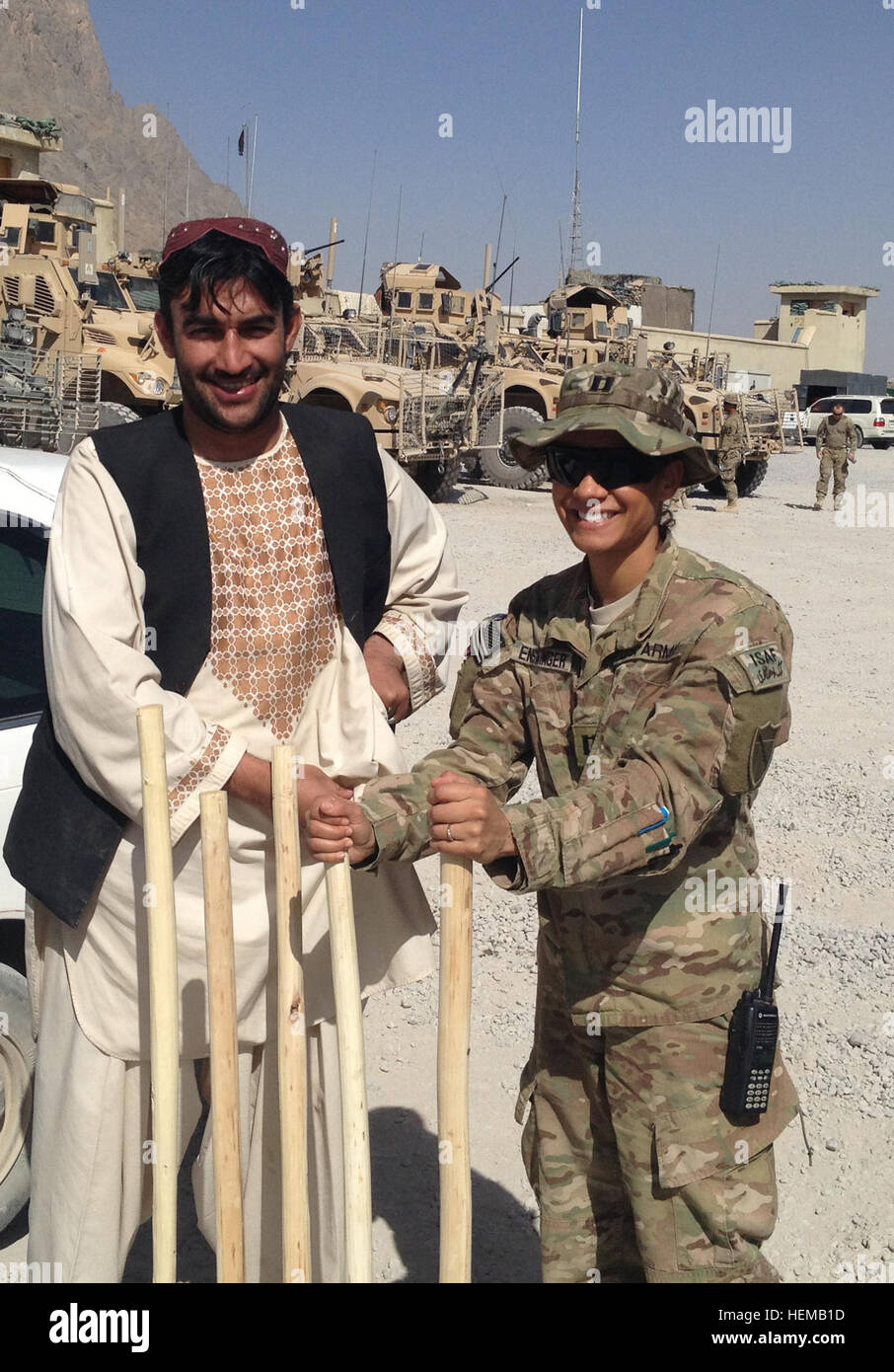 Capt. Varinka Barbini Ensminger receives materials from an Afghan ...