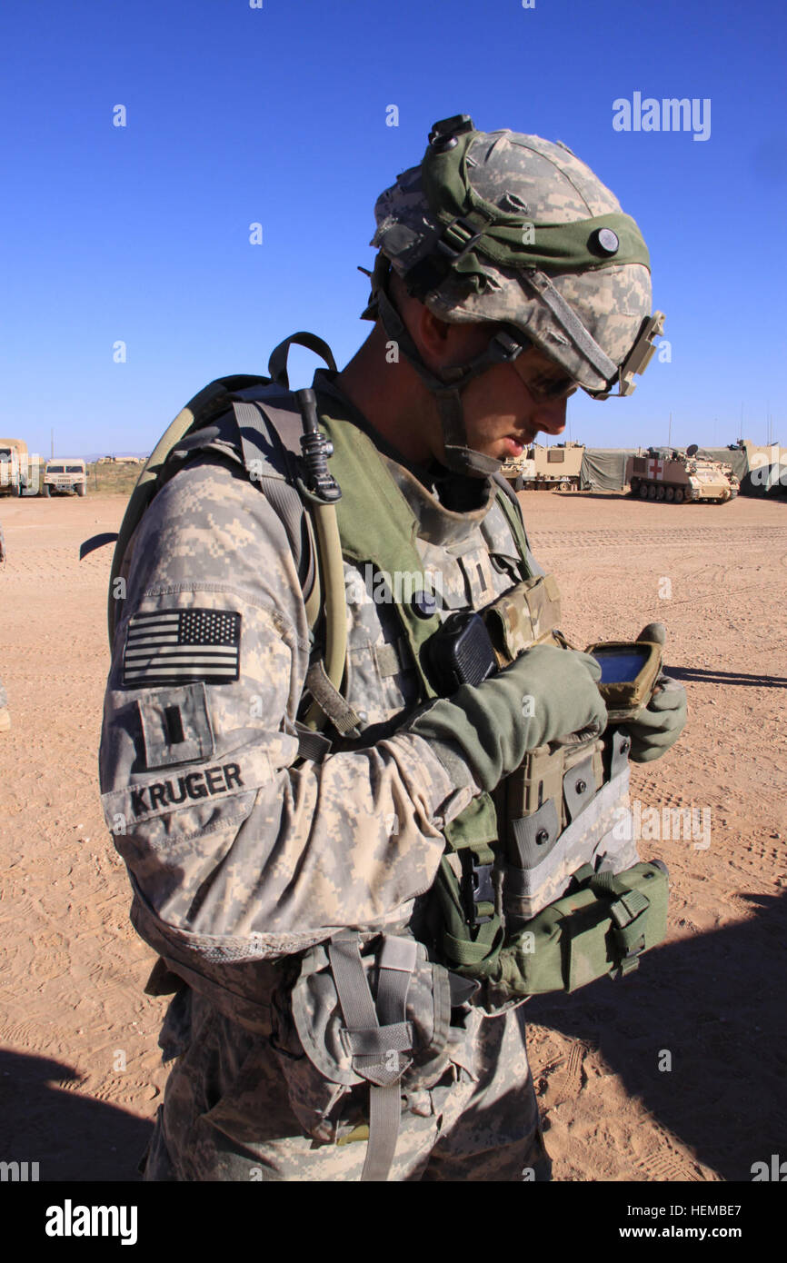 A soldier from the 2nd Brigade, 1st Armored Division uses Nett Warrior ...