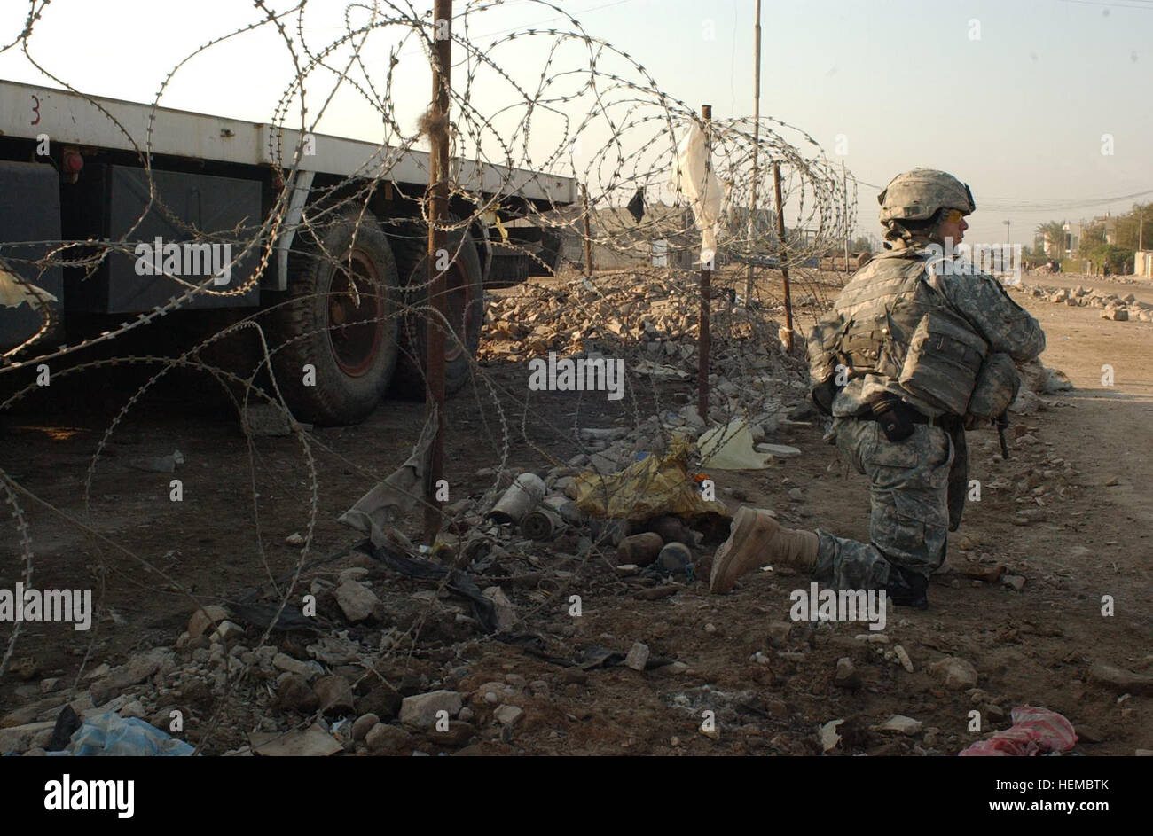U.S. Army Spc. Jonathan Plummer pulls security outside a house during a ...