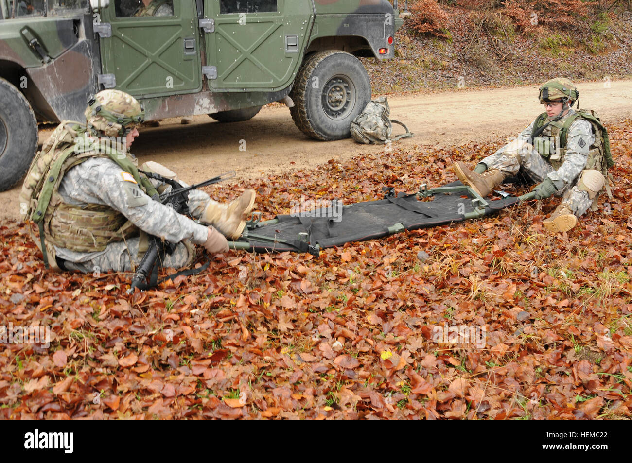 U.S. Army Soldiers from the 370th Engineer Company prepare a litter for ...
