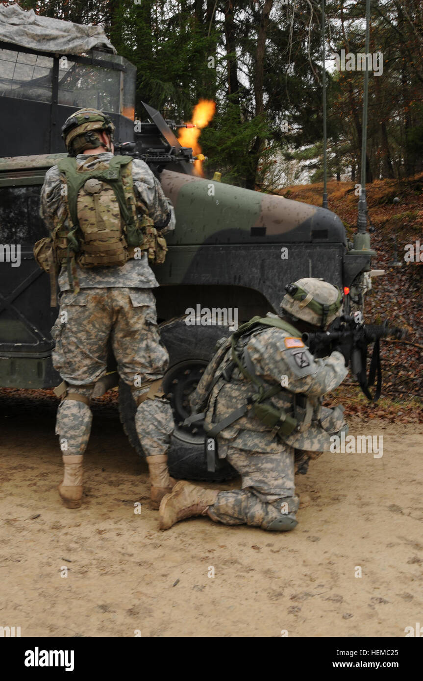 U.S. Army Soldiers from the 370th Engineer Company return fire during a ...
