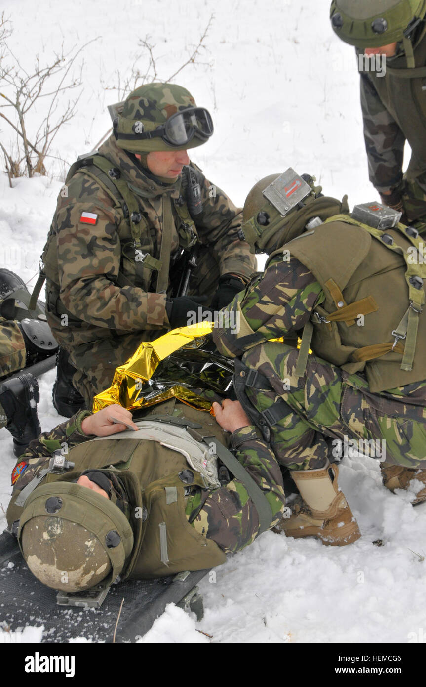 Polish army soldiers administer medical aid to notionally wounded ...