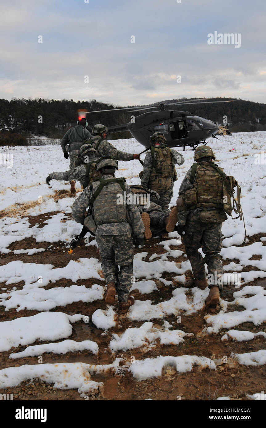 U.S. Army Soldiers from the 541st Engineer Company carry a simulated ...