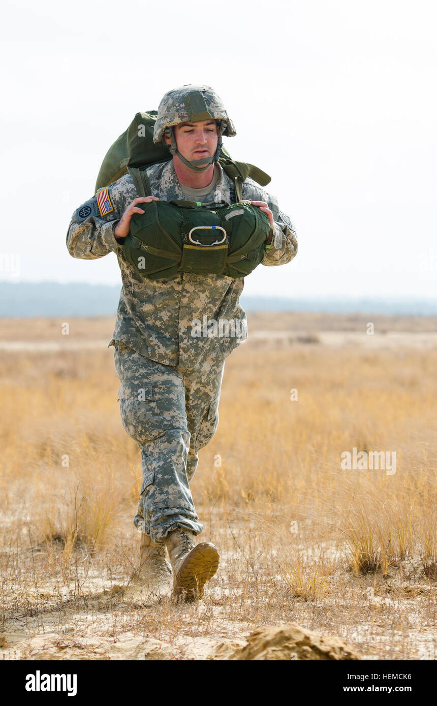 A U.S. Army Soldier leaves the drop zone after completing his jump in ...