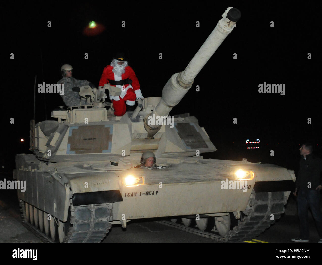 A Mustang Soldier portrayed Santa Claus arriving on an M1A2 Abrams tank ...