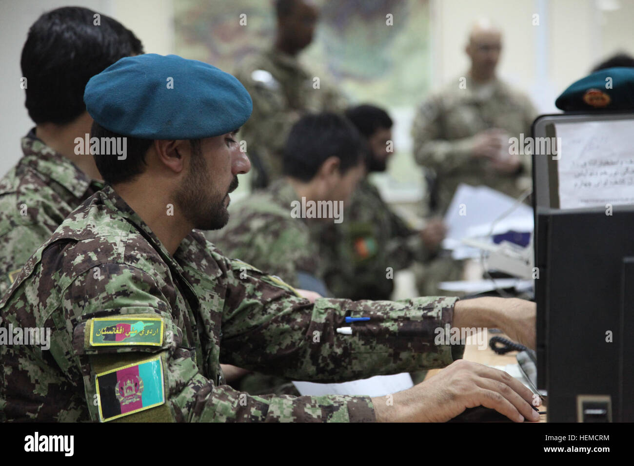 Afghan National Army soldiers work on computers at Forward Operating ...