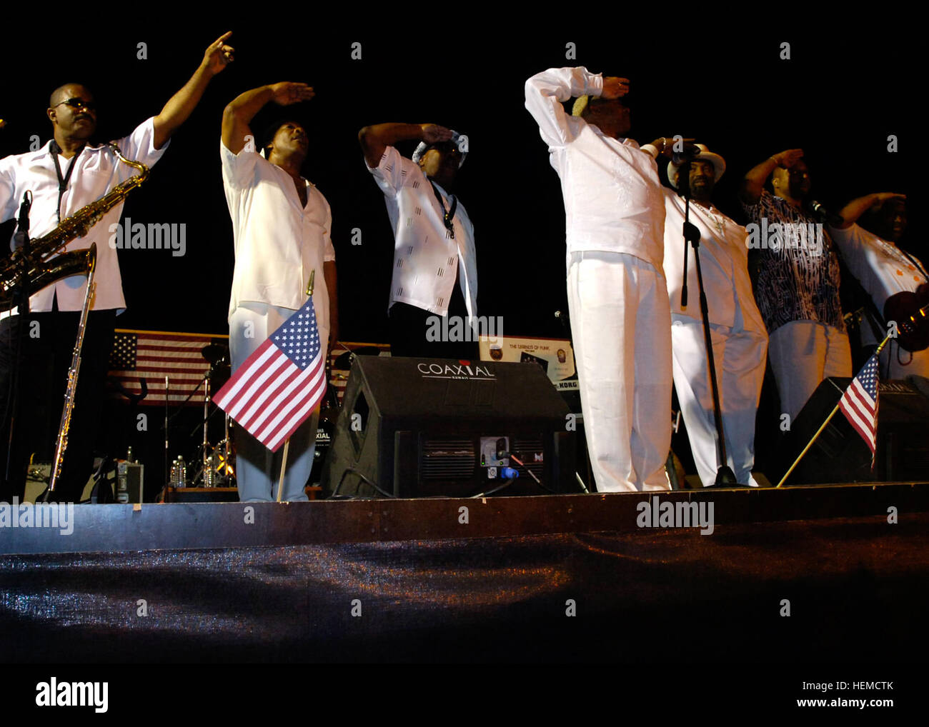 Members of “The Legends of Funk” salute the troops after their ...