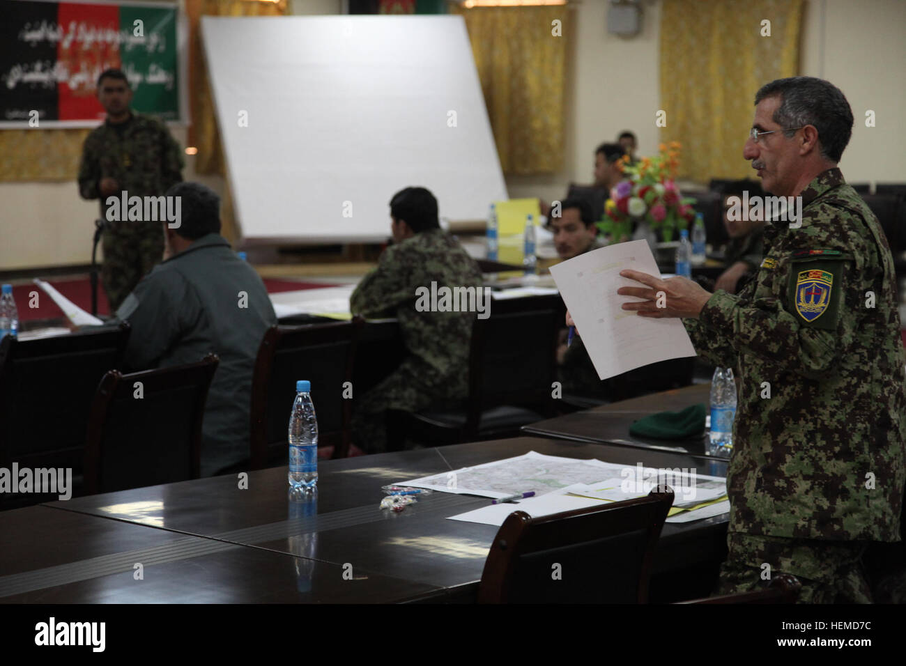An Afghan National Army soldier asks a question on how to plot points ...
