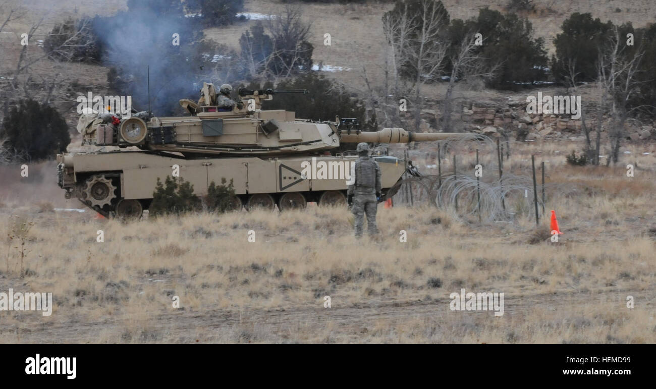 U.S. Army Capt. Jonathan Dyer, center, observe controller and battalion ...