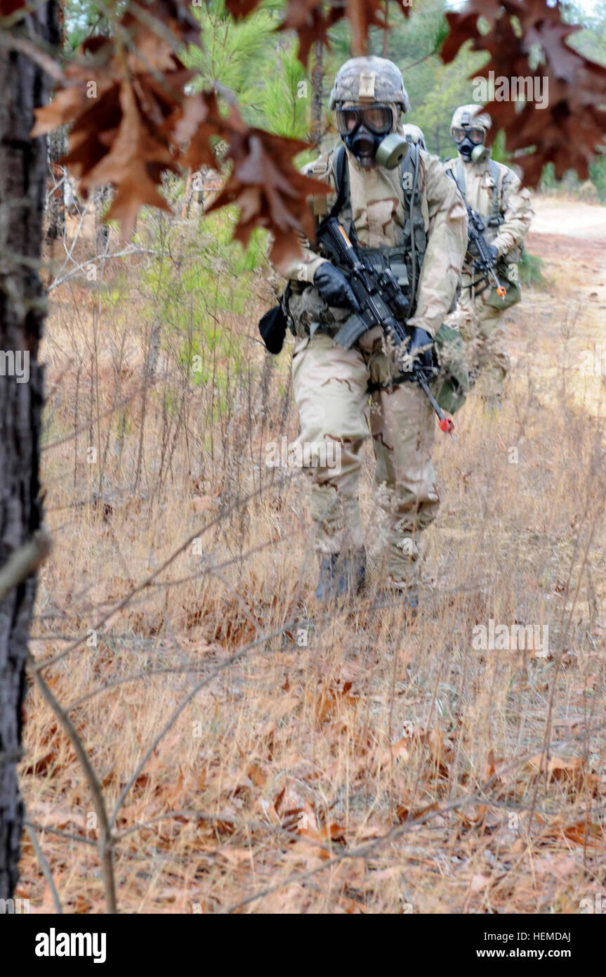Spc. Walter Sauery conducts a tactical movement in full chemical ...