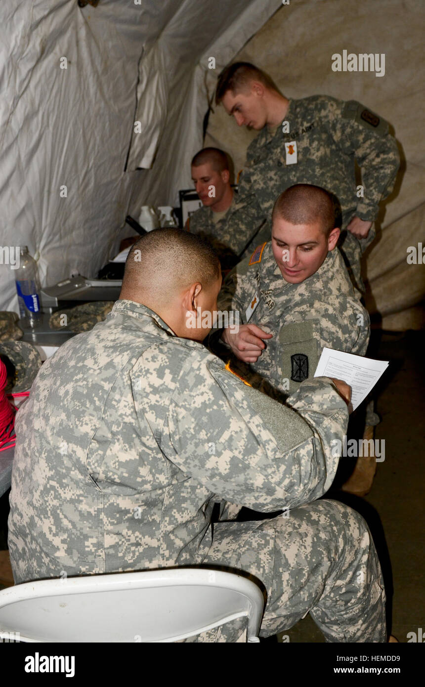 Pfc. Gabriel Santiago, a forward observer, goes over counterfire battle ...
