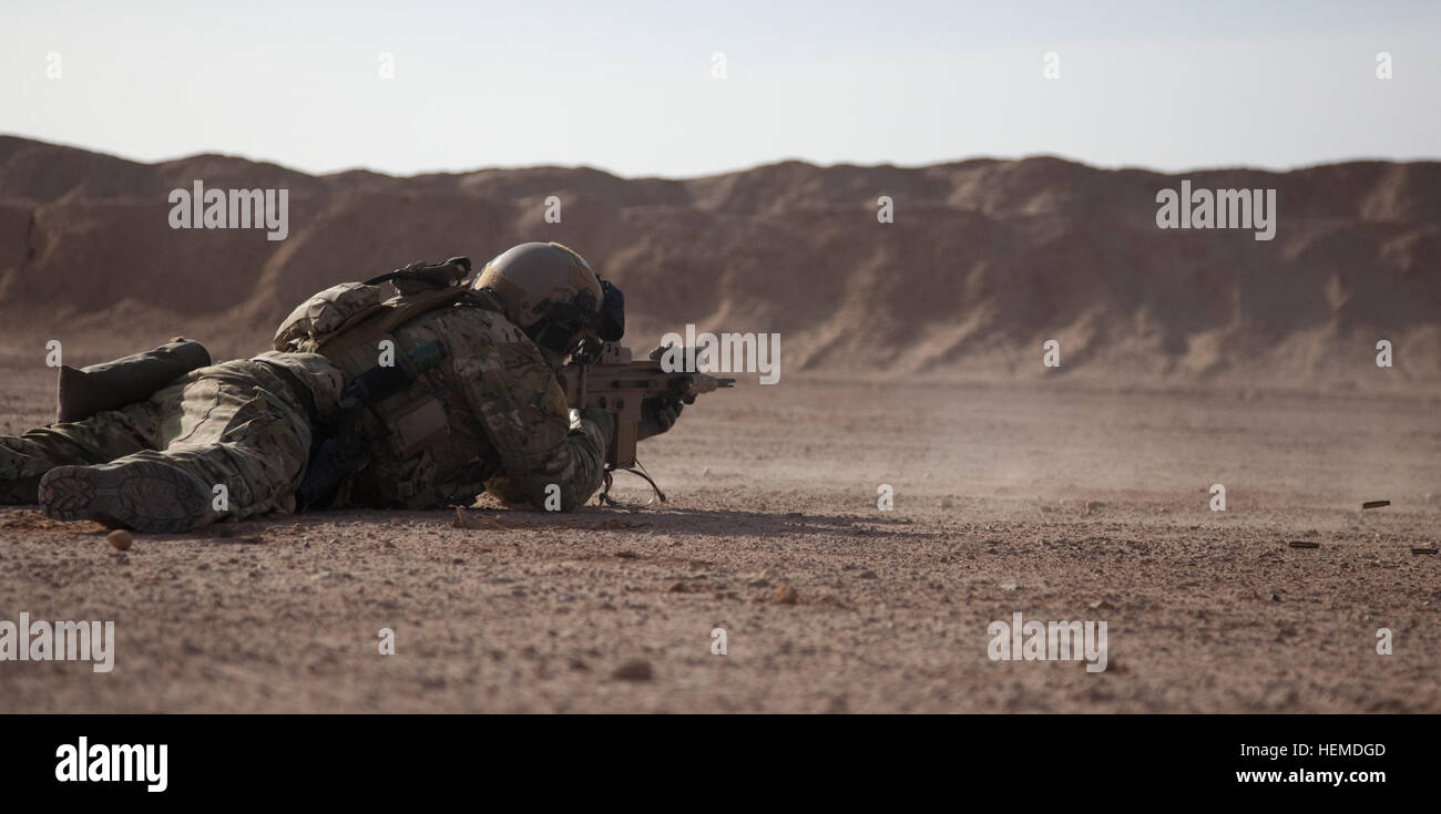 A coalition soldier engages a target at a firing range on Forward ...
