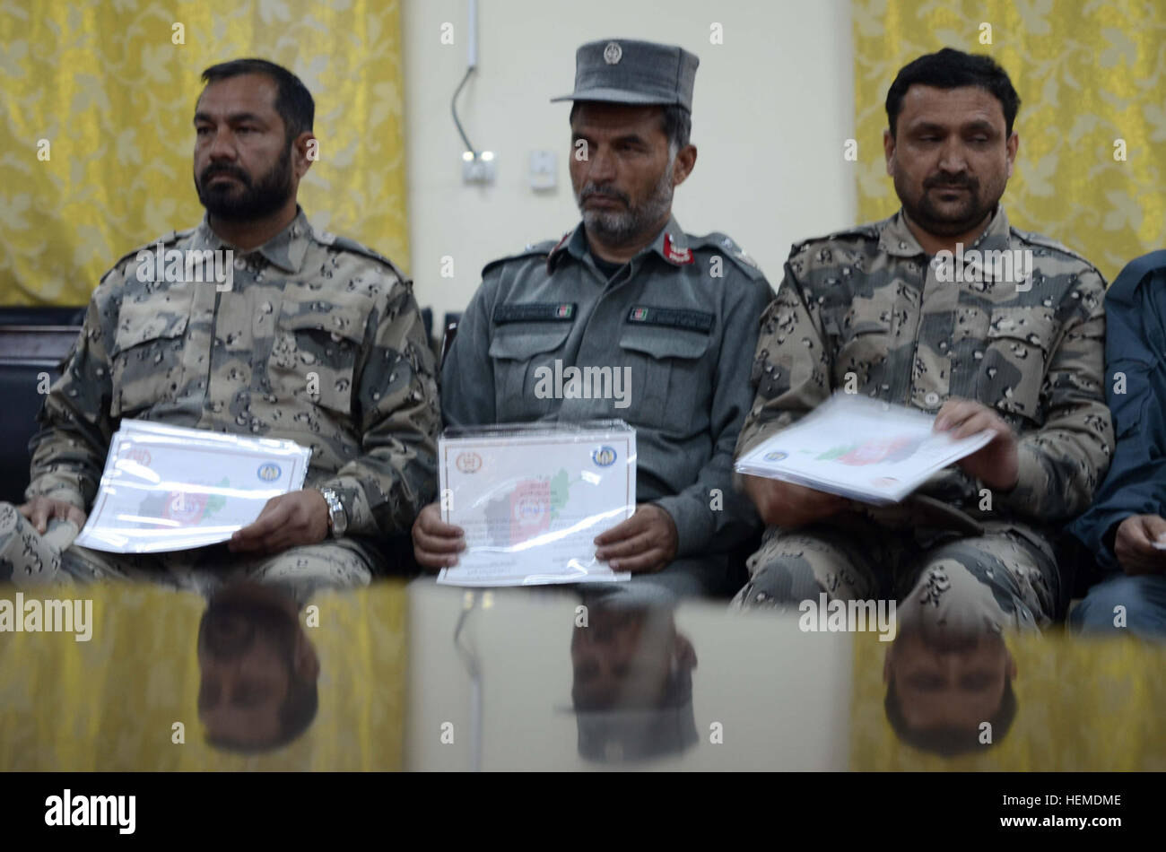 Three graduates of the operation command center foundation course hold ...