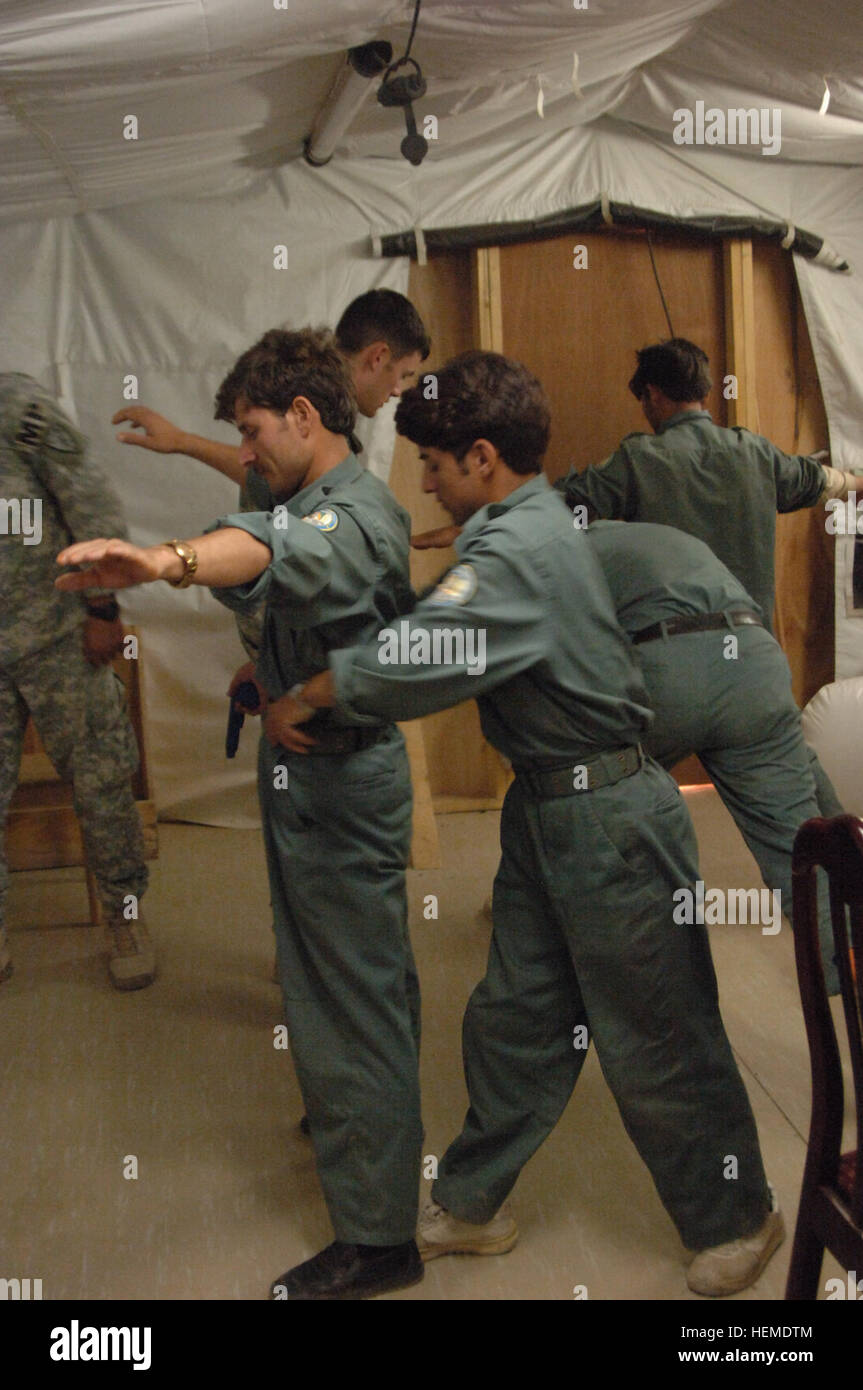 Afghan national police officers practice a low risk personnel search at ...