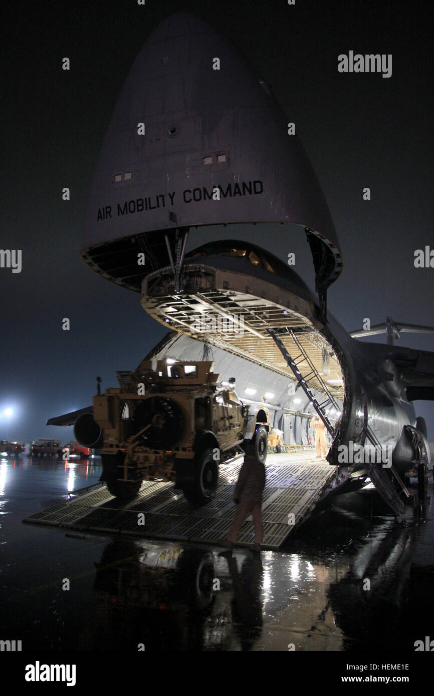 A mine-resistant, ambush-protected vehicle drives onto a U.S. Air Force ...
