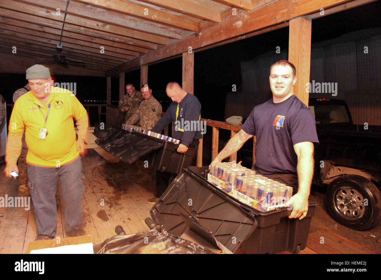 U.S. Army soldiers, assigned to Task Force 3/101, hold up trunks full ...