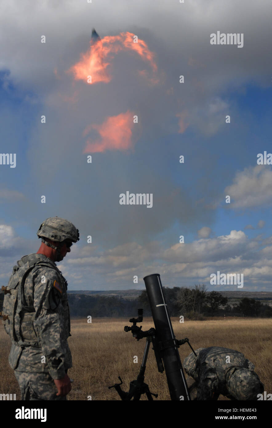 A 120mm mortar round is launched from its tube by mortarmen with Troop ...