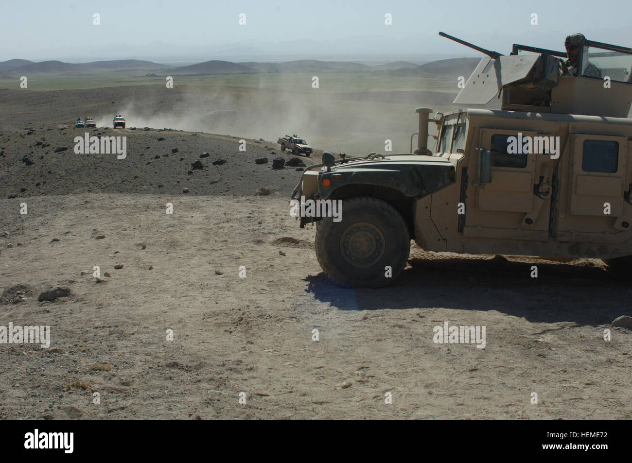 Soldiers from Combined Joint Task Force 82 sit in an outer cordon over ...